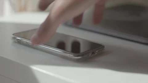 Grabbing Phone Stock Footage ~ Royalty Free Stock Videos | Pond5