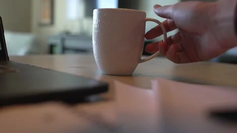 close up hand grabs coffee cup POV home ... | Stock Video | Pond5
