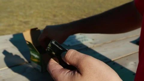 close-up of hand loading bullets in a gu... | Stock Video | Pond5
