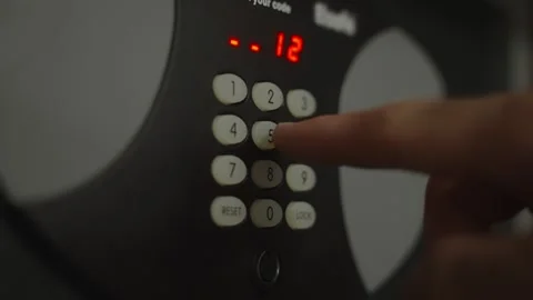 Close up on hand punching keypad and ope... | Stock Video | Pond5