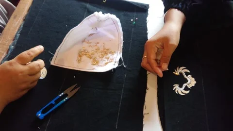 Close up of hand sewing traditional gold... | Stock Video | Pond5