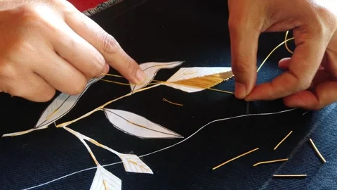 Close up of hand sewing traditional gold... | Stock Video | Pond5