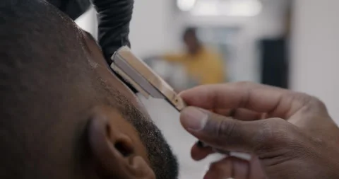 Close-up of hand with sharp blade shavin... | Stock Video | Pond5