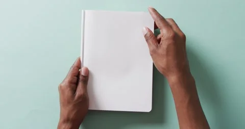 Close up of hand touching a book with co... | Stock Video | Pond5