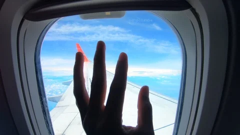 Close up hand in window airplane backgro... | Stock Video | Pond5