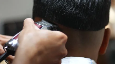 Close-up of hands grooming kid boy hair ... | Stock Video | Pond5