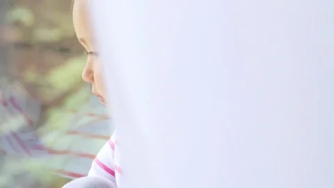 Close up of hands on knees of cute littl... | Stock Video | Pond5