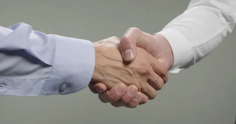 Close up handshake. Male hands shaking i... | Stock Video | Pond5