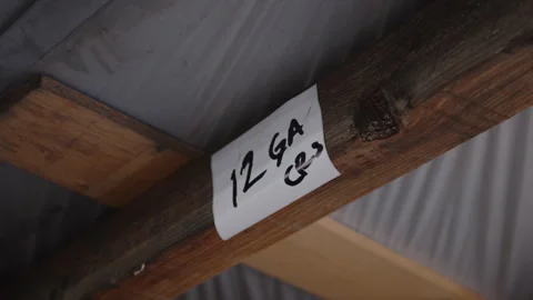 Close-up of a handwritten label '12 GA' ... | Stock Video | Pond5