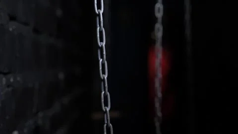 Close-up of hanging chains in the dark o... | Stock Video | Pond5