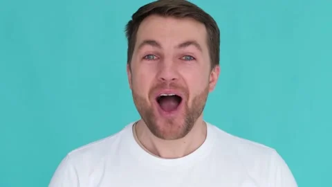 Close-up of a happy man yelling at the c... | Stock Video | Pond5