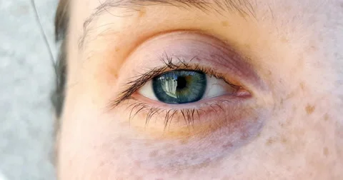 A close up of a human eye, blinking whil... | Stock Video | Pond5
