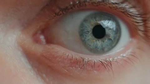 Close up of human eye opening and lookin... | Stock Video | Pond5