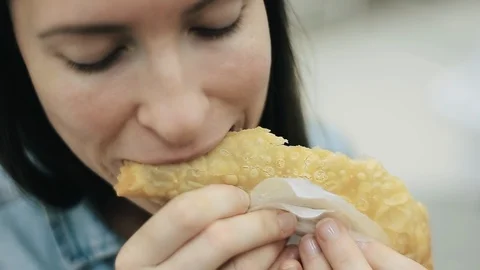 Close-up hungry woman chewing at food co... | Stock Video | Pond5