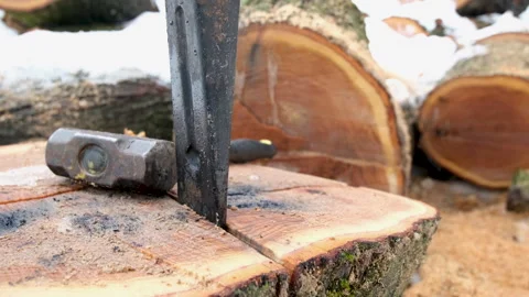 Close up of iron wedge stick into incisi... | Stock Video | Pond5