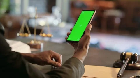 Close Up of Judge Holding Phone with Gre... | Stock Video | Pond5