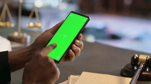 Close up of Judge using Phone with Green... | Stock Video | Pond5