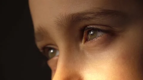 Close-up of the kid eyes. A dreaming boy... | Stock Video | Pond5