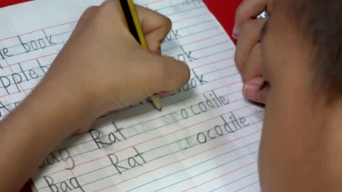 Close up kid rewrite the alphabet | Stock Video | Pond5