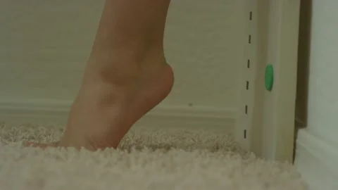Close up of kids feet standing on tip to... | Stock Video | Pond5