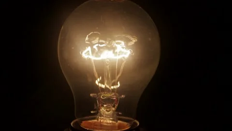 Close up of light bulb lighting up in th... | Stock Video | Pond5