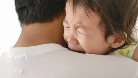 Close-up of a little baby crying, Dad ca... | Stock Video | Pond5