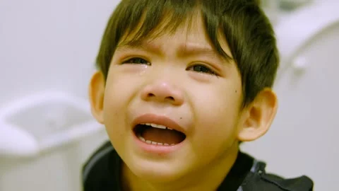 Close-up of a little boy crying while si... | Stock Video | Pond5