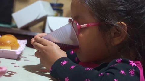 close-up of a little girl drinking chich... | Stock Video | Pond5
