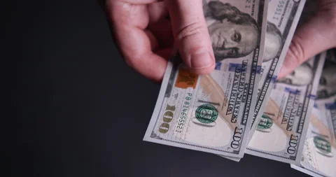 close-up of male hands counting a stack ... | Stock Video | Pond5
