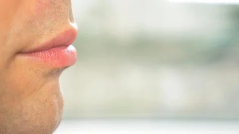 close-up. male lips in profile. A man is... | Stock Video | Pond5