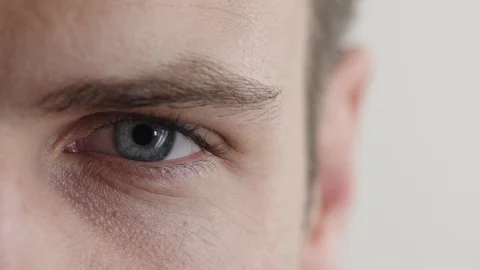 Blue Eye Winking Stock Footage ~ Royalty Free Stock Videos | Pond5