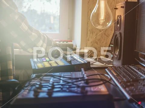 Close up man making music in the home studio using drum machines Stock ...