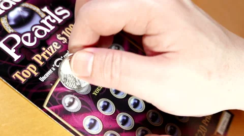 Close up man scratching lottery ticket w... | Stock Video | Pond5