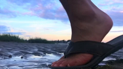 Close Up of a Man Stepping In Water in S... | Stock Video | Pond5