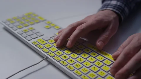 Close-up: A man uses a keyboard with bra... | Stock Video | Pond5