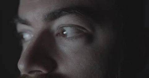 Close up man's eyes watching a screen wi... | Stock Video | Pond5