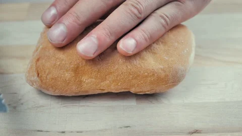 Close-up of a man's hand cutting a burge... | Stock Video | Pond5