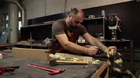 Close up master carpenter in an apron pl... | Stock Video | Pond5