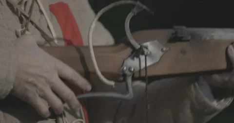 Close-up of medieval handgunner pulling ... | Stock Video | Pond5