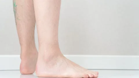 Close-up of men's feet barefoot on a til... | Stock Video | Pond5