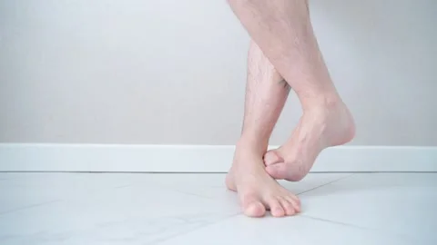 Close-up of men's feet barefoot on a til... | Stock Video | Pond5