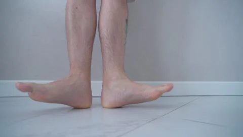 Close-up of men's feet barefoot on a til... | Stock Video | Pond5