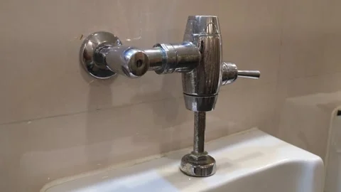 Close-up of a men's urinal flush valve i... | Stock Video | Pond5