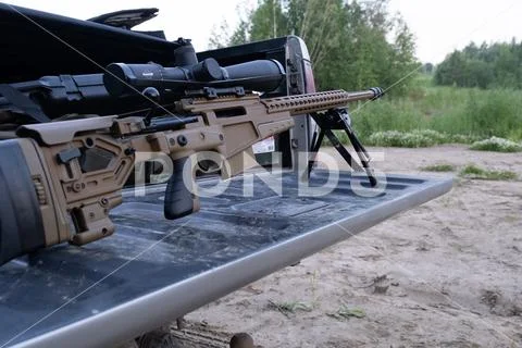 Close up of modern military sniper rifle Stock Photo #122492380