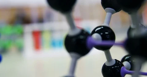 Close-up of molecule model and chemicals... | Stock Video | Pond5