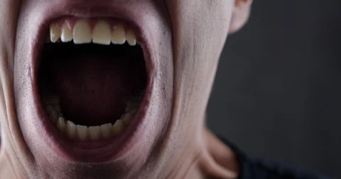 Close up mouth of Angry Man screaming. D... | Stock Video | Pond5