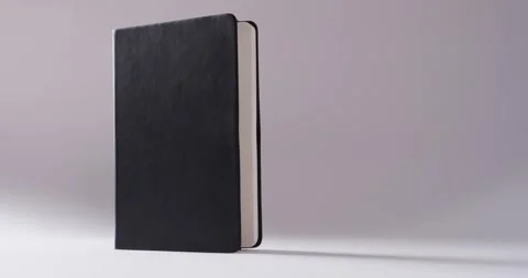 Close up of open black book standing ver... | Stock Video | Pond5