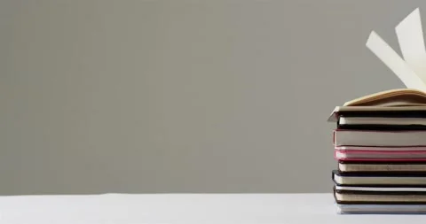 Close up of open book on stack of books ... | Stock Video | Pond5