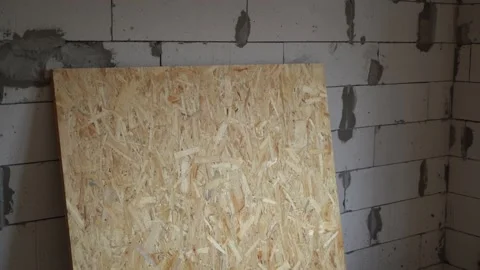 Close-up osb sheet stale on a bare wall ... | Stock Video | Pond5