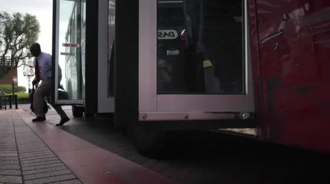 Close up of people stepping off the bus ... | Stock Video | Pond5